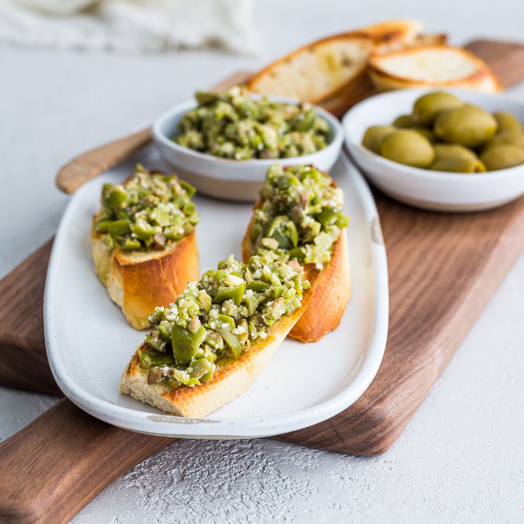 Green Olive Parmesan Crostini Recipe | The Feedfeed